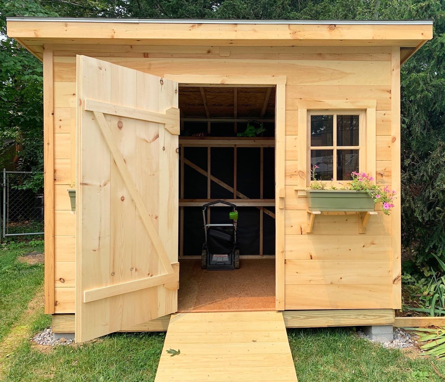 Custom shed with window flower boxes
